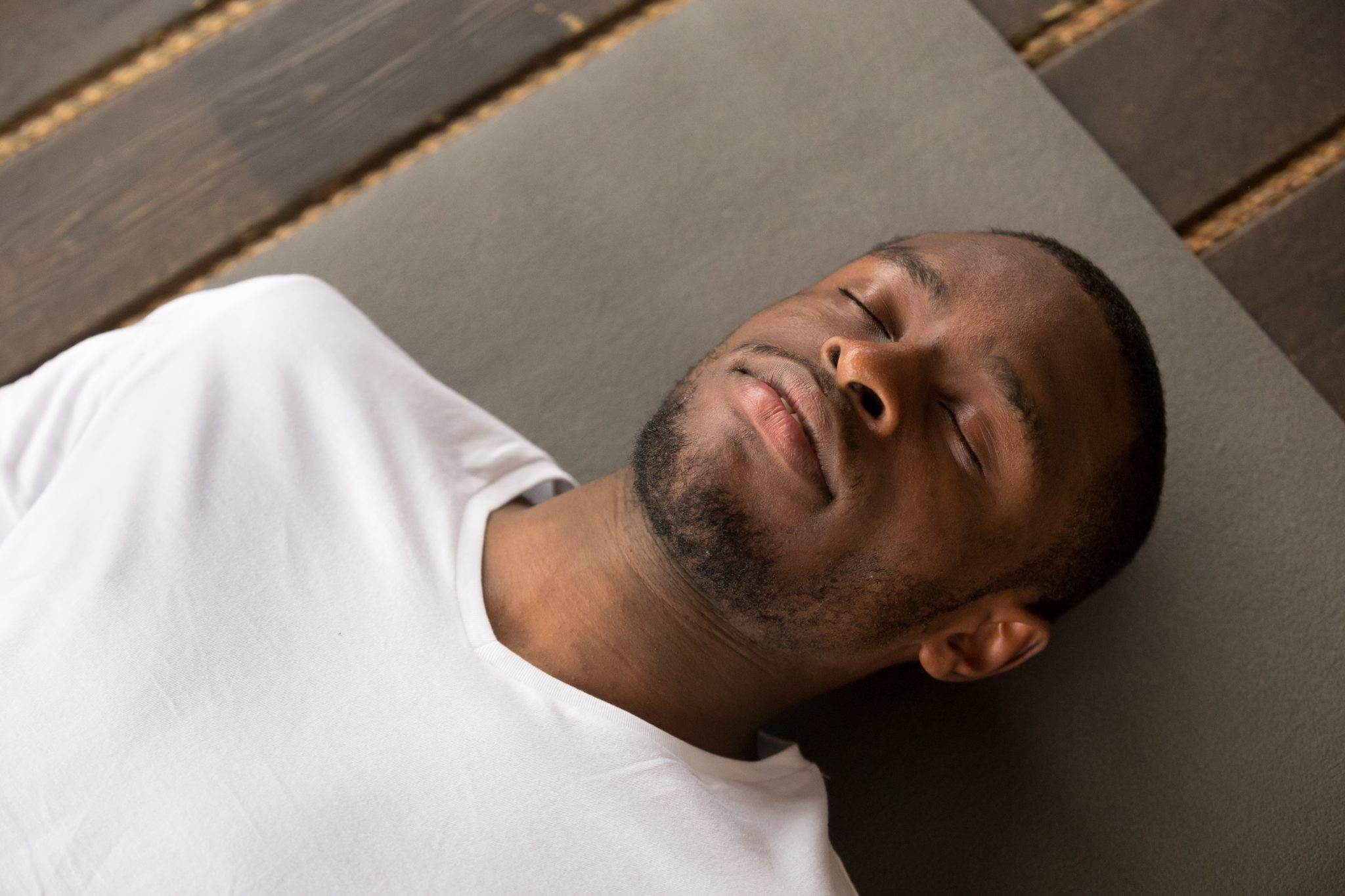 Young black man lying in Dead Body exercise | ObservaPICS